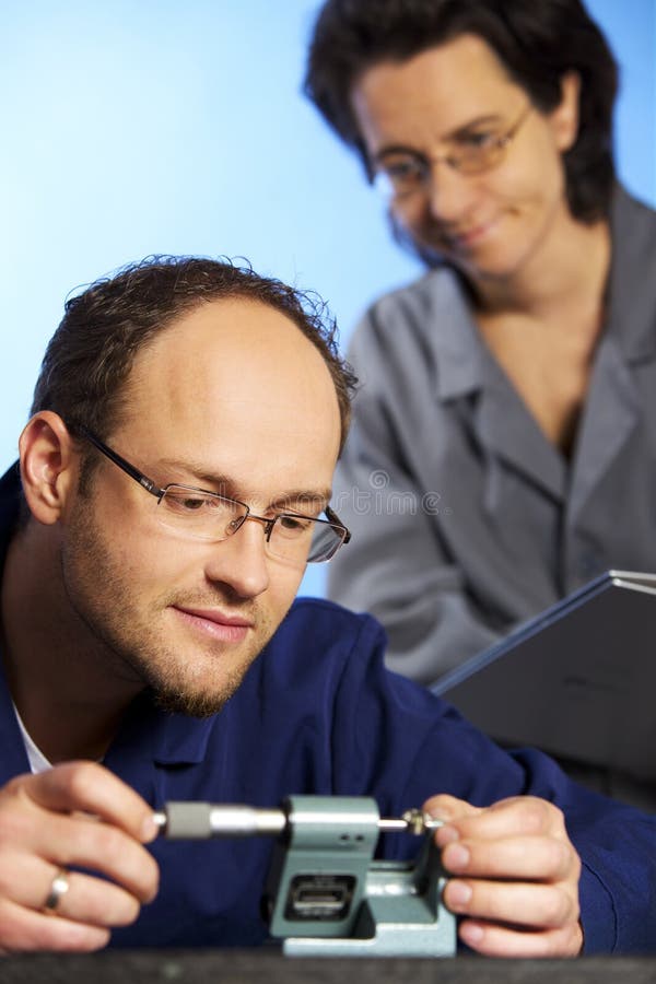 Young engineer measuring stock photo. Image of measurement - 14420734