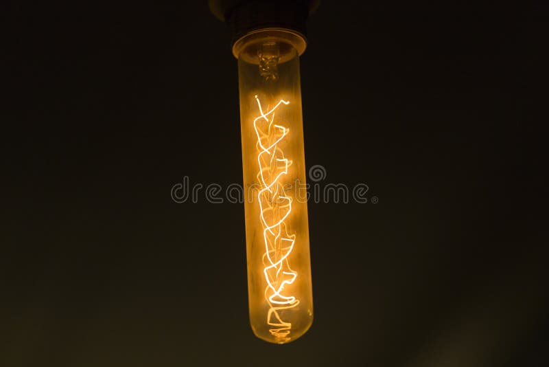 Filament of a Electric Light Bulb Stock Photo - Image of design, dark ...
