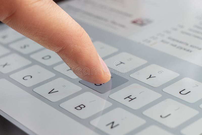 A Macro of a Finger Typing Text on the Touch Screen Keyboard of Mobile ...