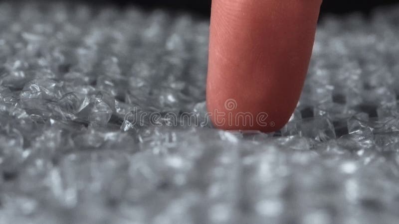 Man Bursts Bubbles on a Packaging Bubble Wrap Stock Video - Video of fragile, wrap: 257754815