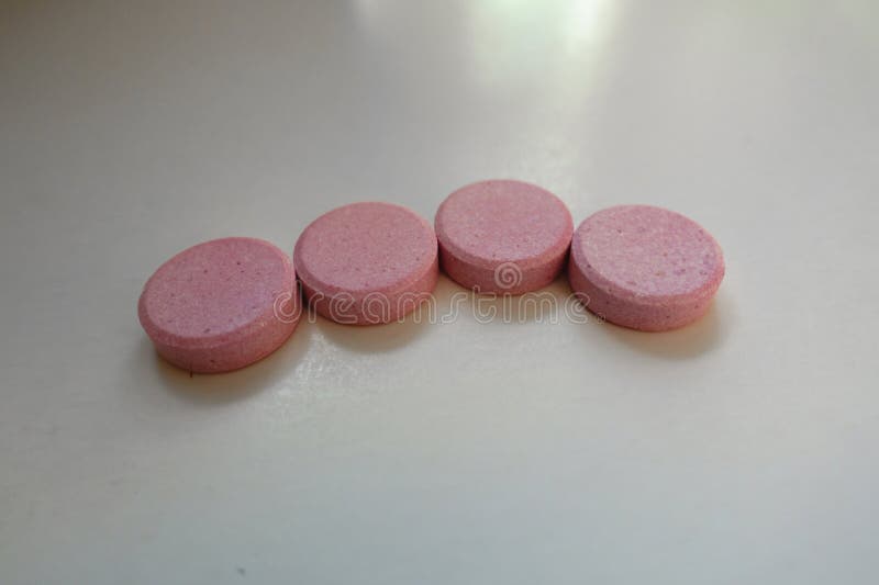 Macro of Four Pink Oral Probiotic Tablets Stock Photo - Image of ...