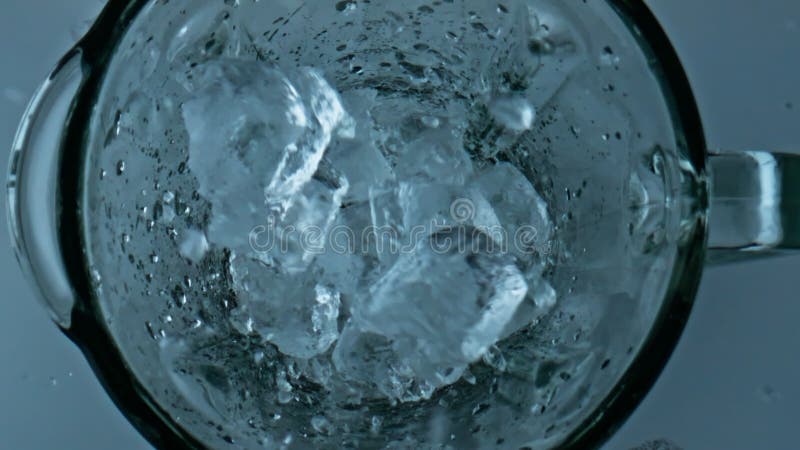 Closeup Blender Crushing Ice Top View. Iced Cubes Grinding in Mixer ...