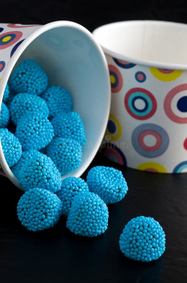 Macro Image of Blue Candies with Colorful Bowls on Black Stock Image ...