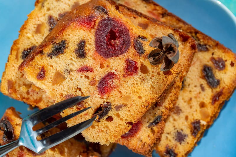 Macro Image of a Cake Slice with Fruits and a Dessert Fork. Fruit Cake ...
