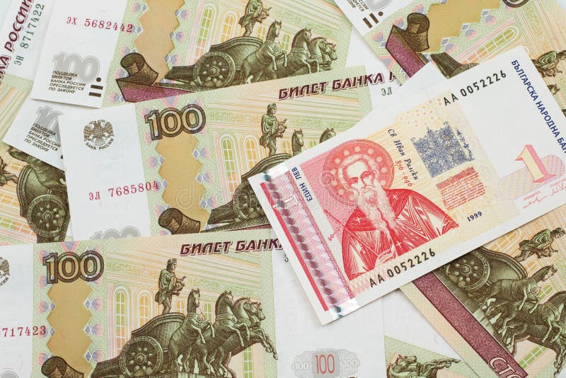 A Red and White Bulgarian One Lev Note with a Gold Coin in Macro Stock ...