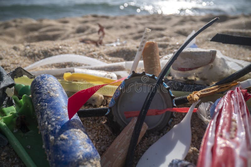Plastic discarded on beach stock photo. Image of discard - 202498104