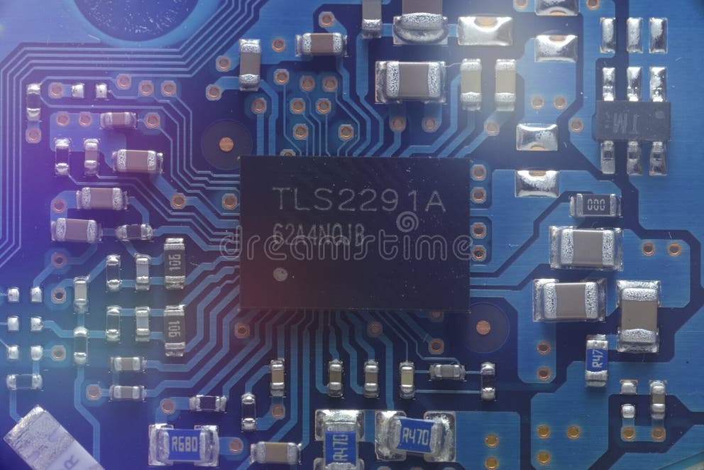 Macro Image of TLS2291A Microchip on Blue PCB with High-Density Surface ...