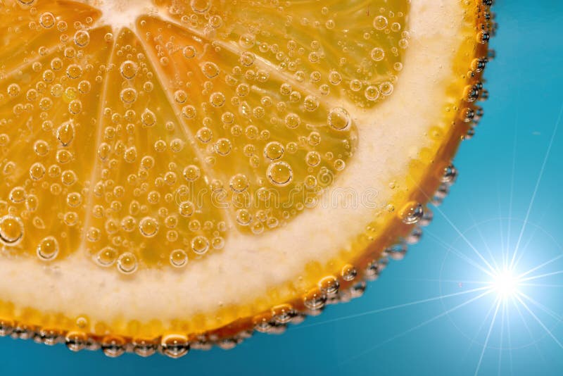 Macro of Lemon Slice with Bubbles and Lens Flare Stock Photo - Image of ...