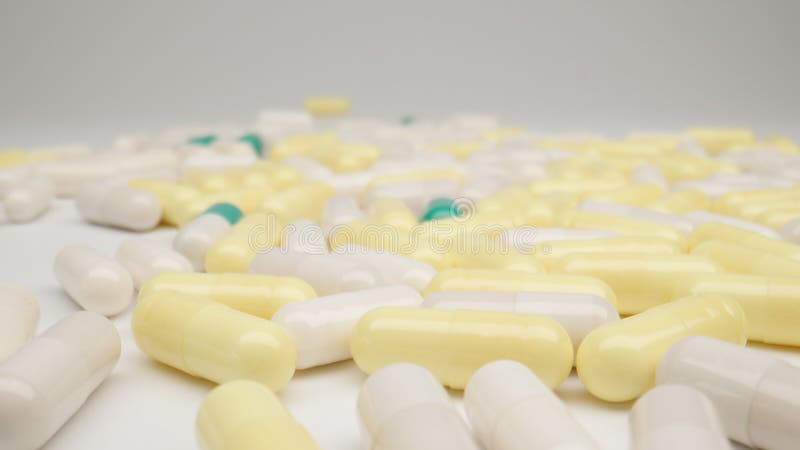 MACRO: Many of Capsules on a White Table Stock Photo - Image of ...