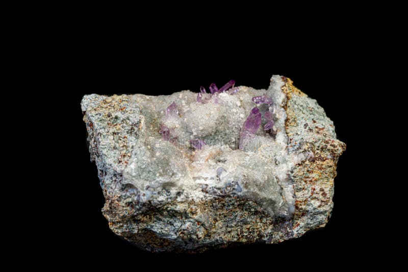 Macro Mineral Amethyst Stone in Rock on a Black Background Stock Image ...