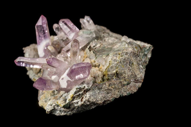Macro Mineral Stone Amethyst Crystals in Rock on a Black Background ...