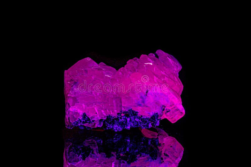 Macro Mineral Stone Calcite Under Ultraviolet Light on a Black ...