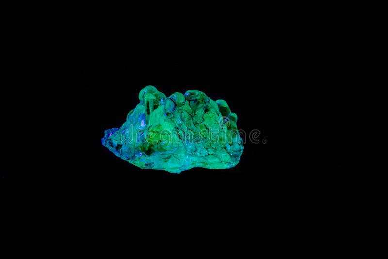 Macro Mineral Stone Opal Under Ultraviolet Light on a Black Background ...