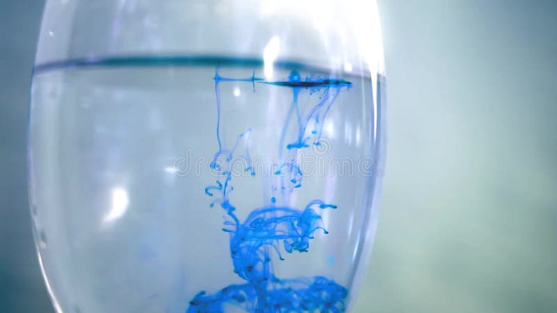 Macro Mixing of Green Fluids of Different Density Stock Footage - Video ...