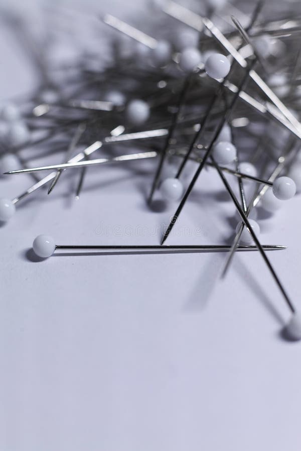 A Bunch of Pins and Needles on a Table Stock Image - Image of wing ...