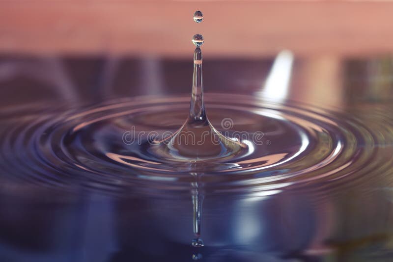 Macro Photo of Water Drops Falling into a Pool of Water Stock Photo ...