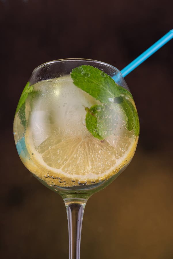 Macro Photo of a Wine Glass with Lemon and Mint. a Straw in a Wine ...