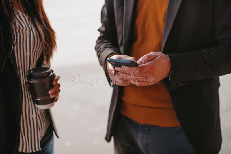 Macro Photo of Young People Using the Phone during a Break from Work ...