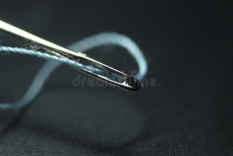 Small Needle with Thread in the Eyelet, Isolated Over the Black ...