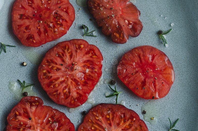 Macro Photograph of Sliced Tomato with Dressing on Blue Plate Stock ...