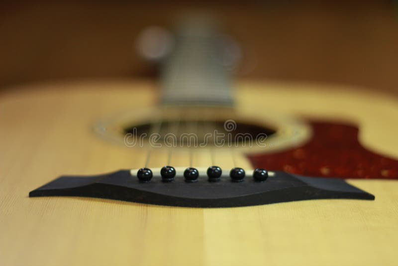 Macro of a Professional Acoustic Guitar on a Brown Wooden Table Stock ...