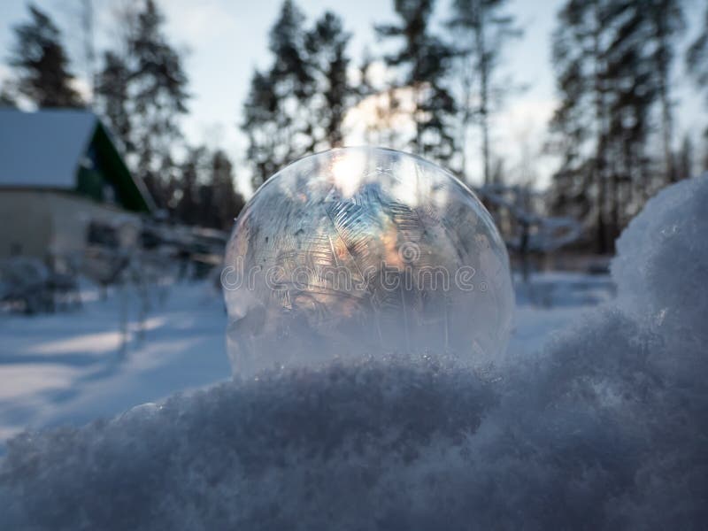 Round, Frozen Soap Bubble Forming Beautiful Leaf and Tree Like Pattern ...