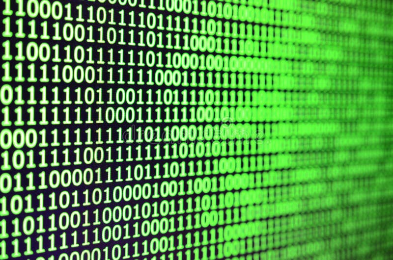 Macro Shot of Binary Code on the Monitor of an Office Computer. the ...