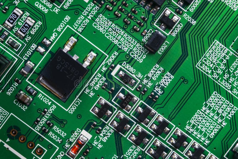 Macro Shot of a Circuitboard with Resistors Microchips and Electronic ...