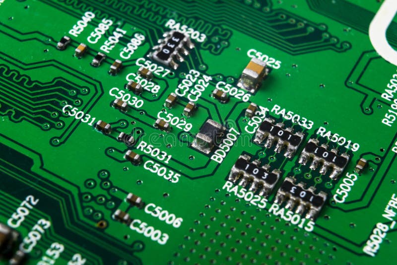 Macro Shot of a Circuitboard with Resistors Microchips and Electronic ...