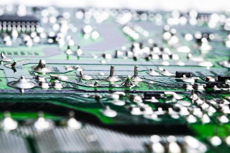 Macro Shot of a Circuitboard with Resistors Microchips and Electronic ...
