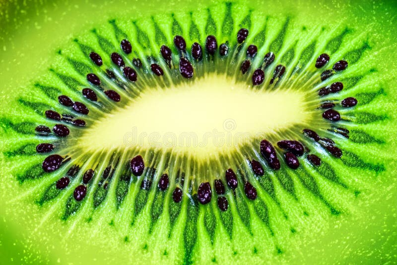 Macro Shot of a Green Sliced Kiwi Fruit with Seeds Background. Stock ...