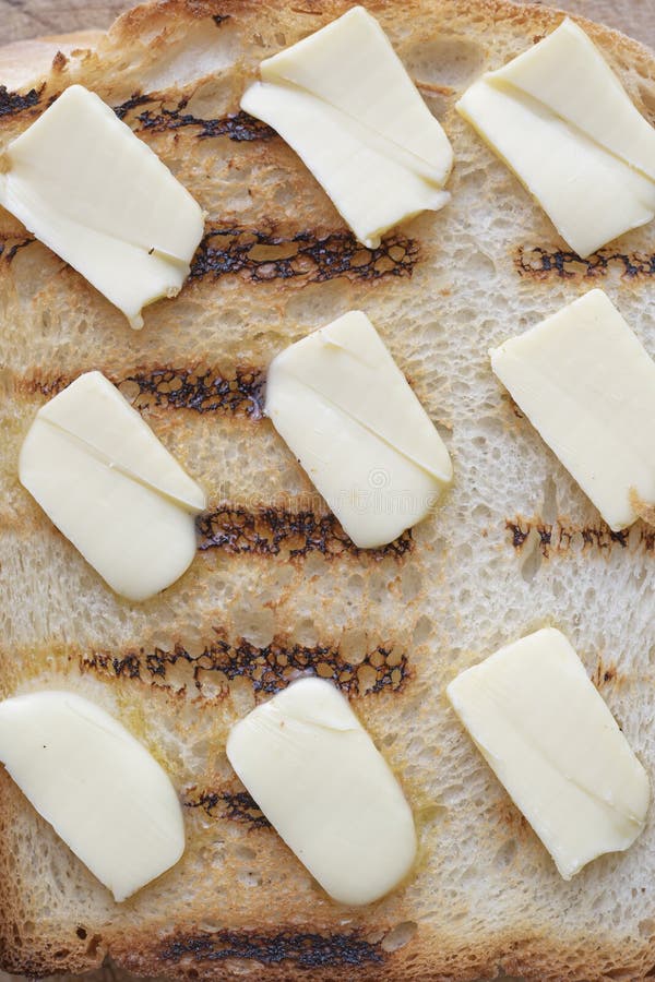 Macro Shot of a Grilled Slice of Bread, with Butter Stock Photo - Image ...