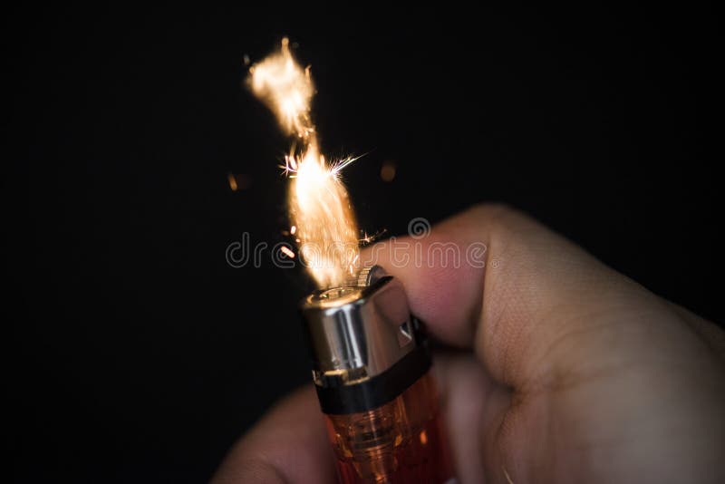 Macro Shot of Hand Lighting Up Lighter Stock Photo - Image of spark ...
