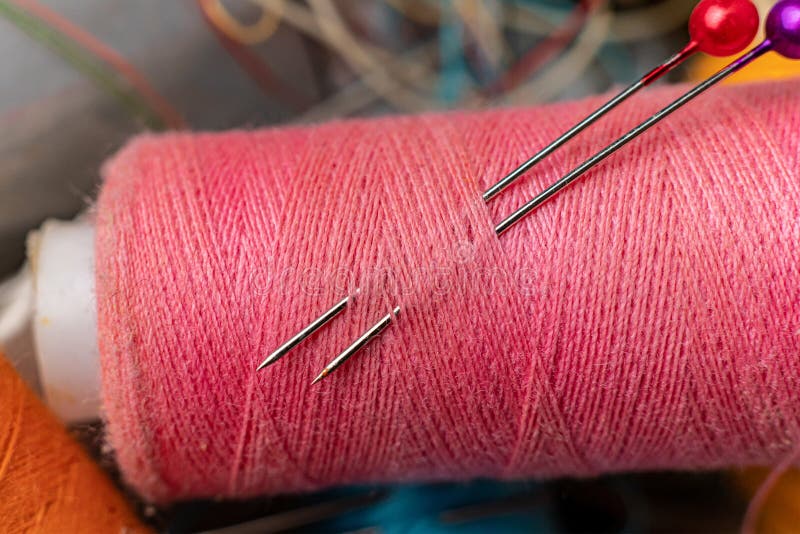 Macro Shot of Needle Inserted in the Color Thread Rolls Stock Photo ...