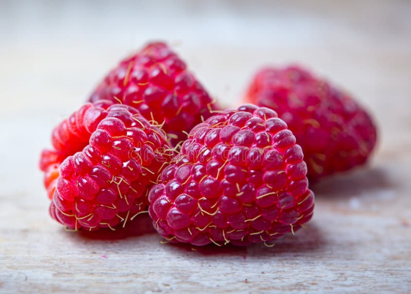 Macro Shot of Raspberry. a Group of Four Raspberries Isolated on Light ...