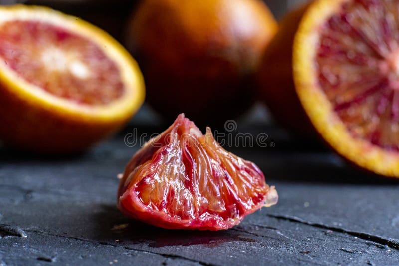 Macro Shot of Red Mandarin Slice on Dark Surfaces Stock Photo - Image ...