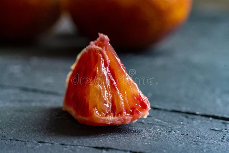 Macro Shot of Red Mandarin Slice on Dark Surfaces Stock Photo - Image ...