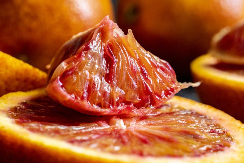 Macro Shot of Red Mandarin Slice on Dark Surfaces Stock Photo - Image ...