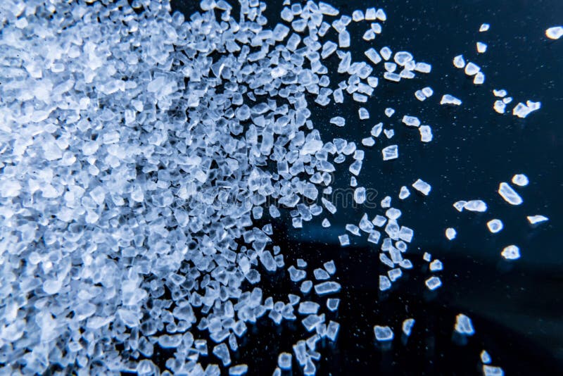 Macro Shot of Salt Crystals on Black Mirror Surface, Reflections B ...