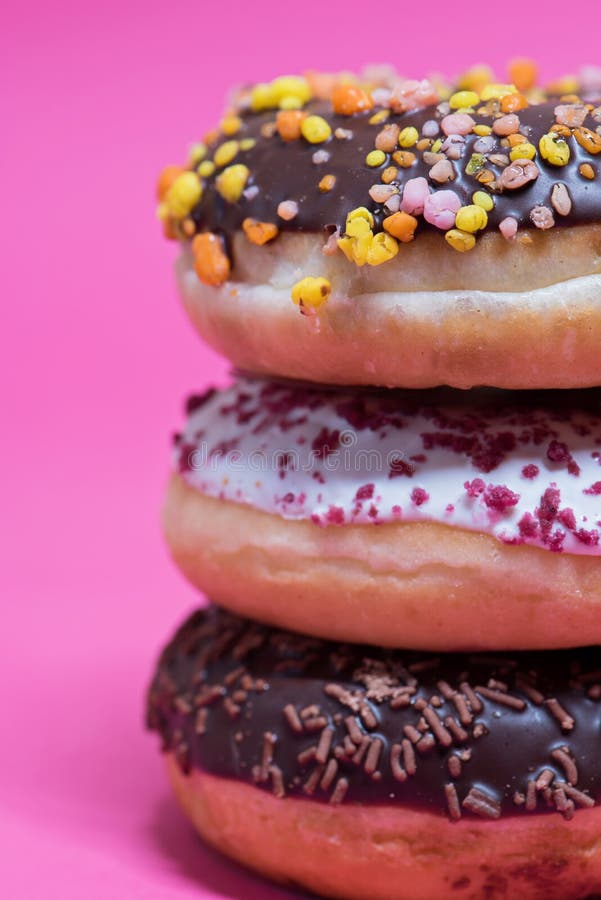 Macro Shot of Stack of Donuts Over Pink Stock Image - Image of baked, food: 258321845