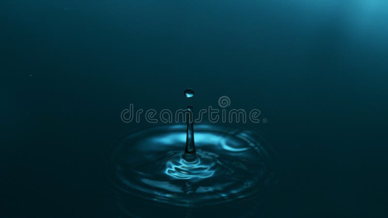 Macro Shot of Water Drop Splashing into Liquid Stock Image - Image of ...