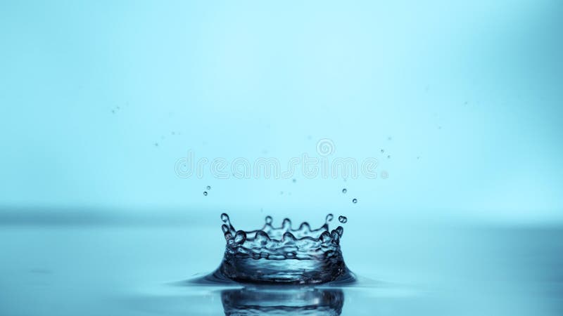 Macro Shot of Water Drop Splashing into Liquid Stock Image - Image of ...