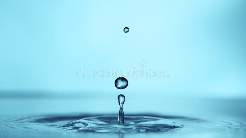 Macro Shot of Water Drop Splashing into Liquid Stock Image - Image of ...