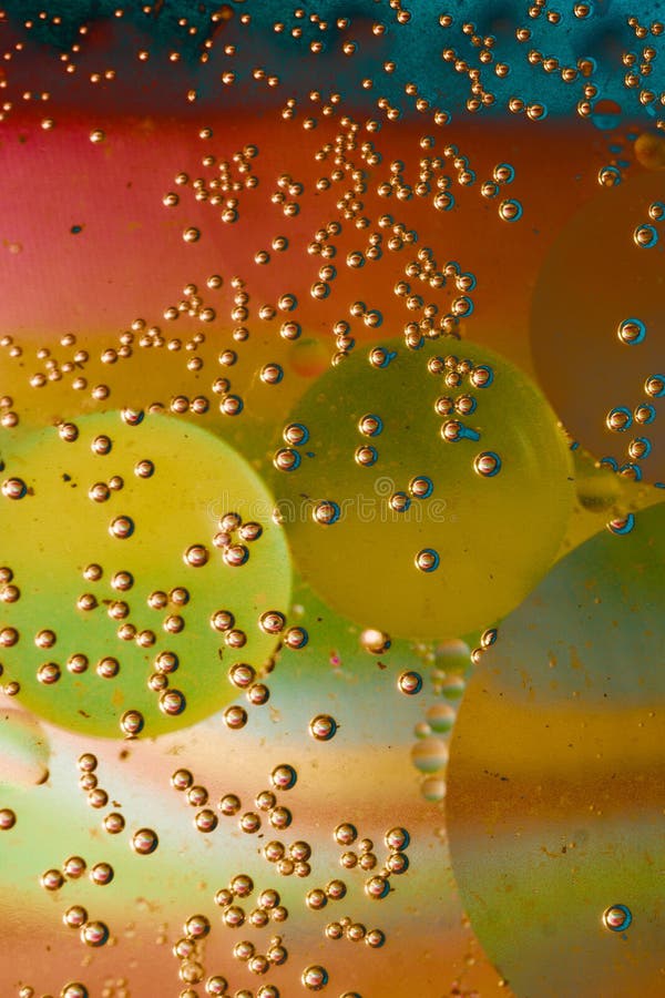 Macro Shot of Water Oil Emulsion Over Colored Background Stock Photo ...
