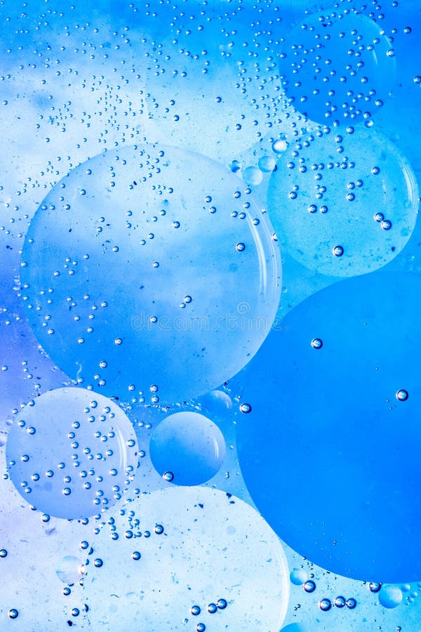 Macro Shot of Water Oil Emulsion Over Colored Background Stock Photo ...