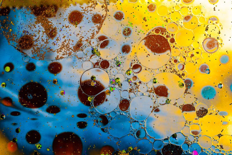 Macro Shot of Water Oil Emulsion Over Colored Background Stock Photo ...