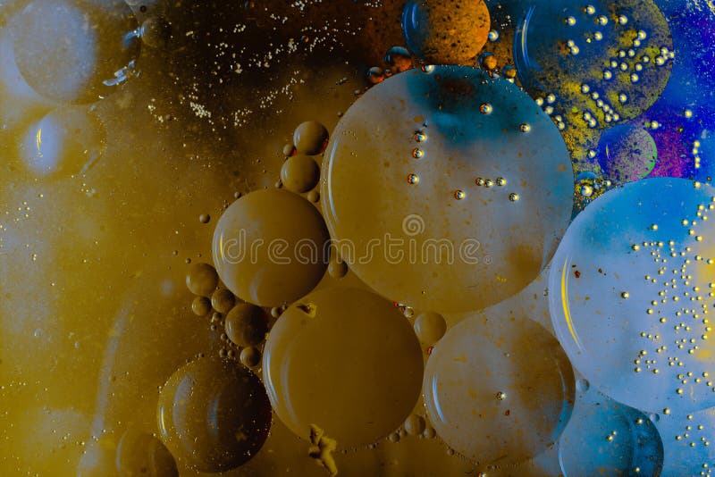 Macro Shot of Water Oil Emulsion Over Colored Background Stock Photo ...