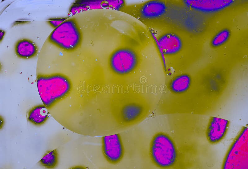 Macro Shot of Water Oil Emulsion Over Colored Background Stock Photo ...