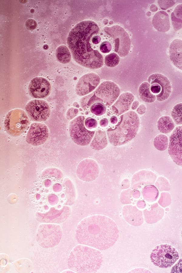 Macro Shot of Water Oil Emulsion Over Colored Background Stock Image ...