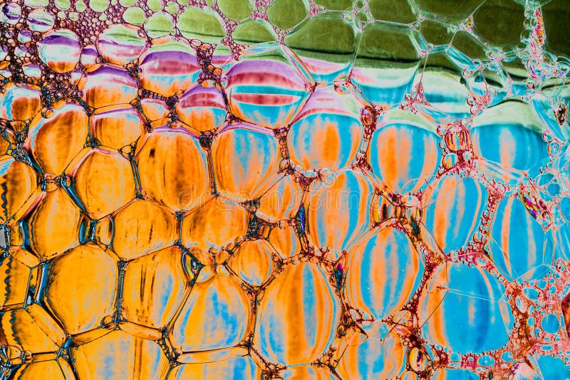 Macro Shot of Water Oil Emulsion Over Colored Background Stock Image ...